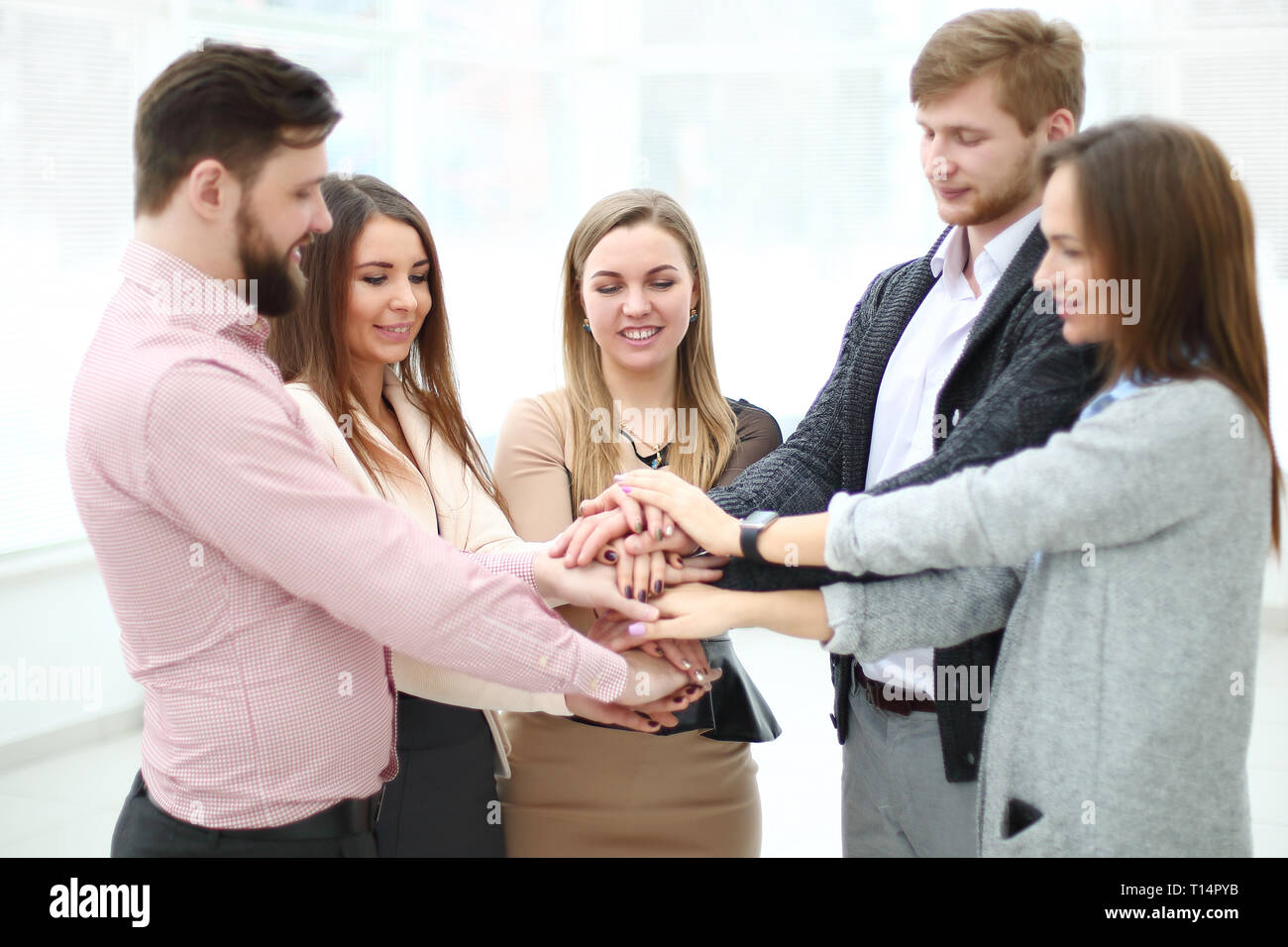 Professional business successful team stacking hi-res stock photography ...