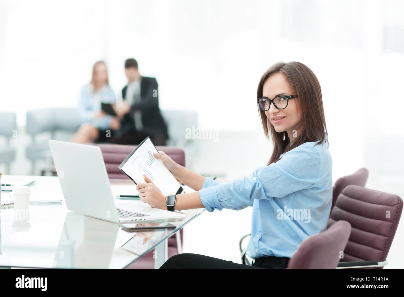 Successful young female executive using hi-res stock photography and ...