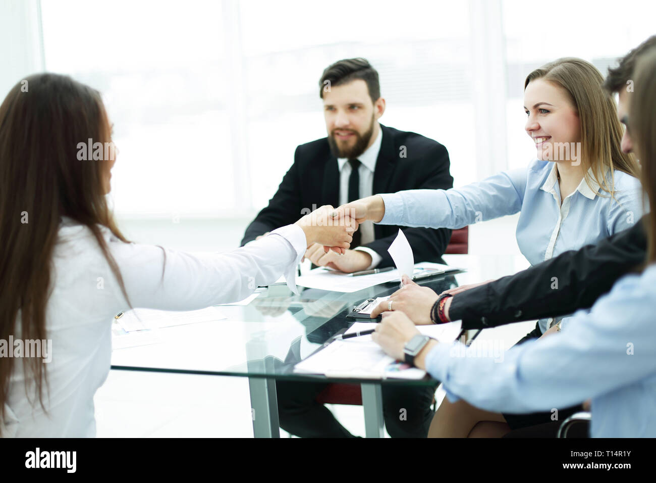 colleagues confirming the job with a handshake Stock Photo - Alamy