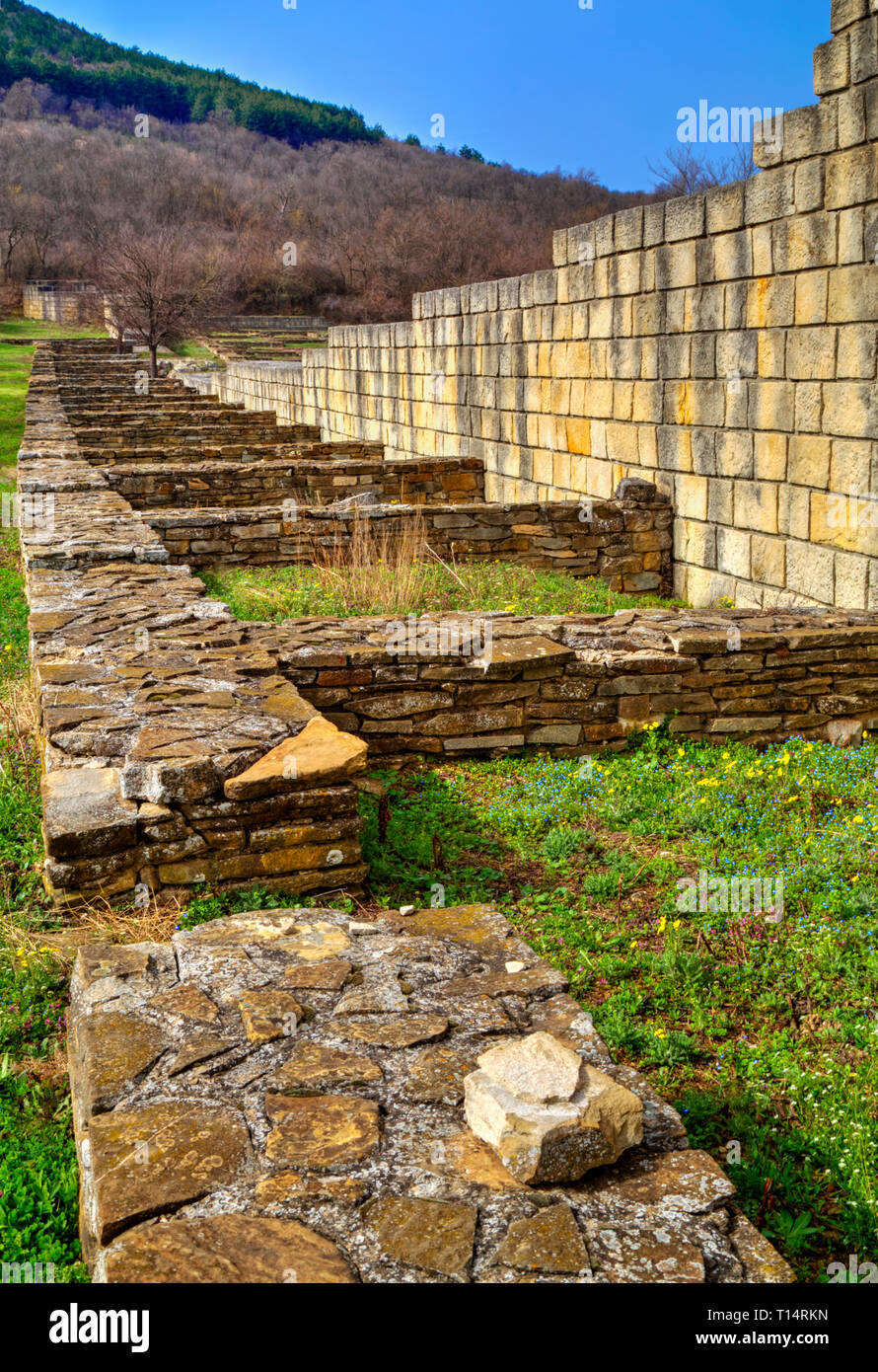 Solid stone wall and ruins of ancient fortress Stock Photo - Alamy