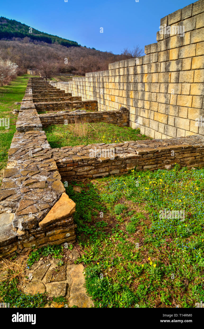 Solid stone wall and ruins of ancient fortress Stock Photo - Alamy
