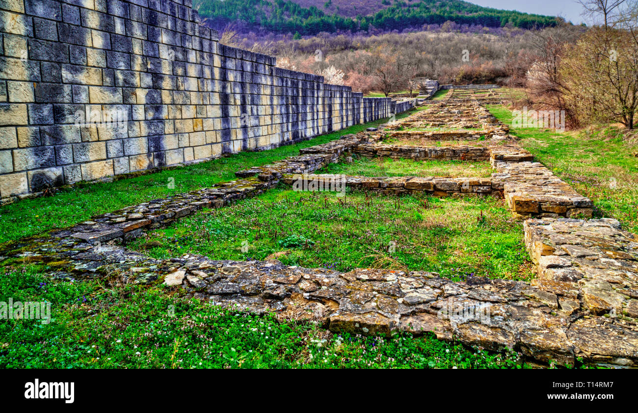 Solid stone wall and ruins of ancient fortress Stock Photo - Alamy