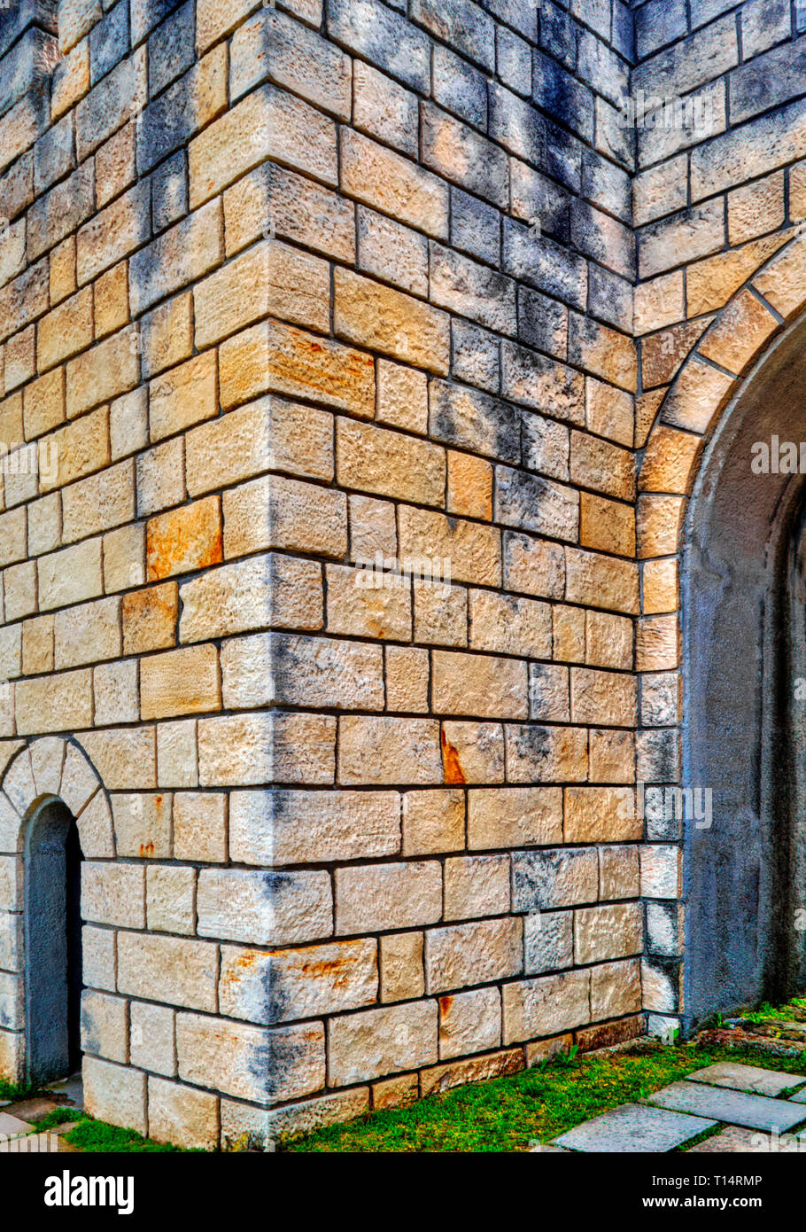 Solid stone wall and entrance of ancient fortress Stock Photo - Alamy