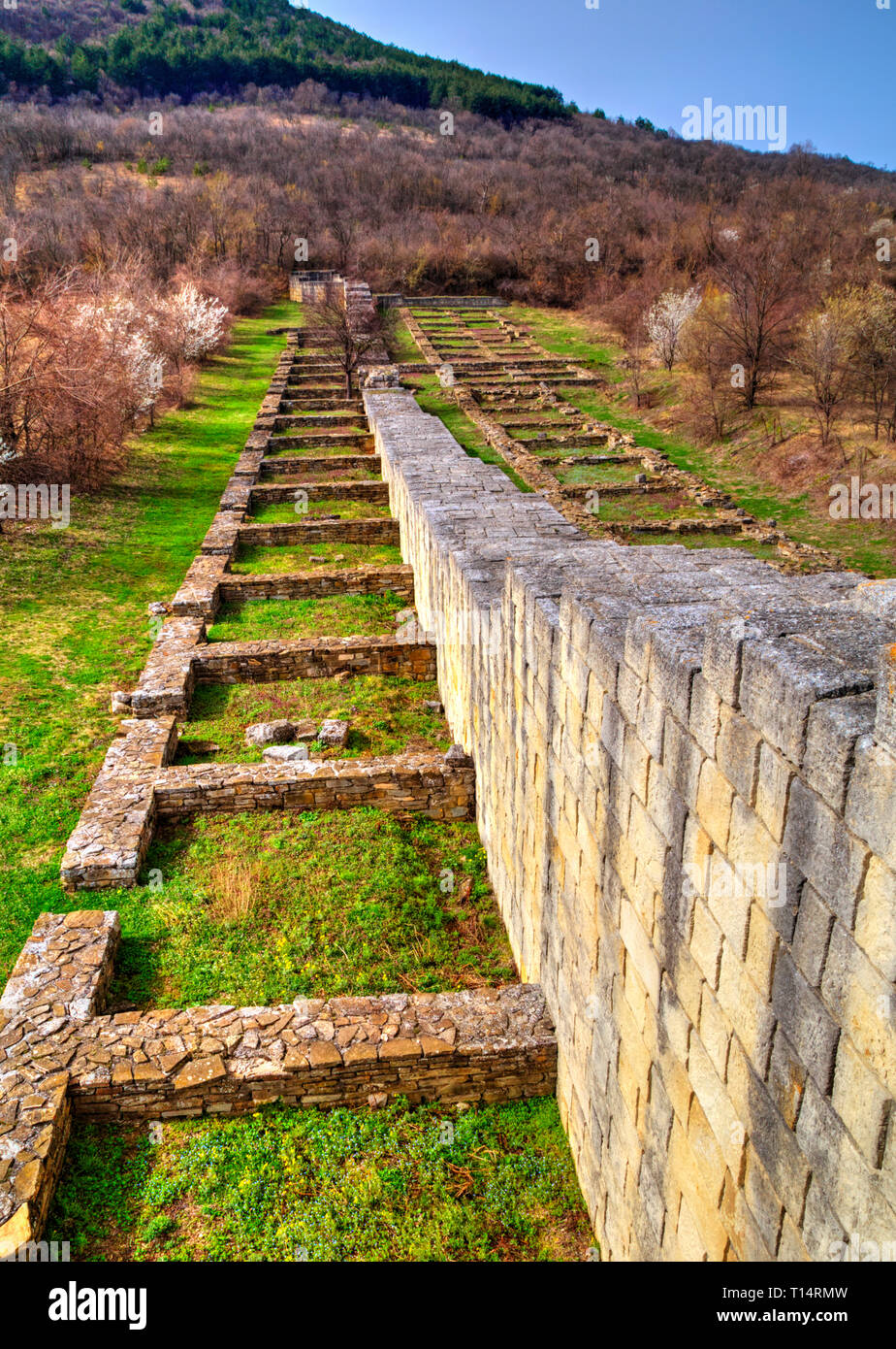 Solid stone wall and ruins of ancient fortress Stock Photo - Alamy