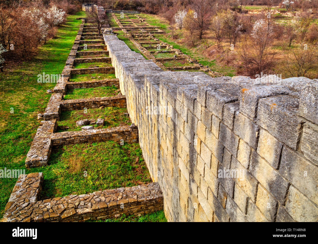 Solid stone wall and ruins of ancient fortress Stock Photo - Alamy