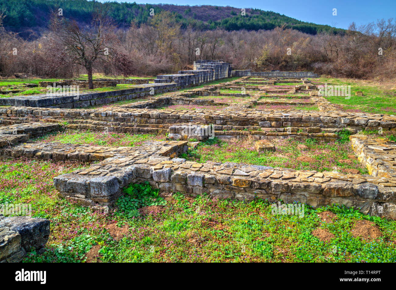 Solid stone wall and ruins of ancient fortress Stock Photo - Alamy