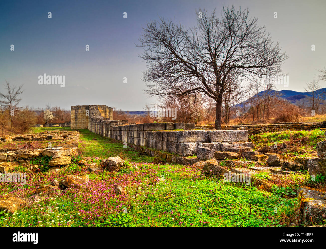 Solid stone wall and ruins of ancient fortress Stock Photo - Alamy