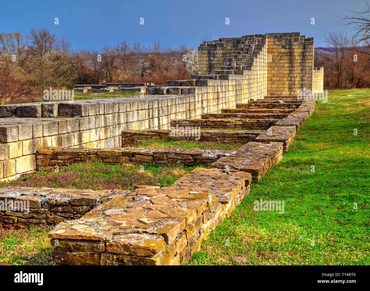 Solid stone wall and ruins of ancient fortress Stock Photo - Alamy