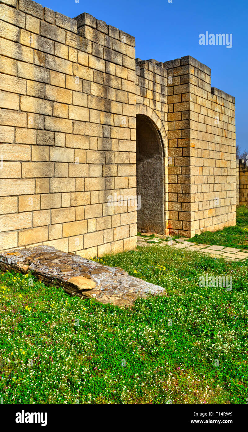 Solid stone wall and entrance of ancient fortress Stock Photo - Alamy