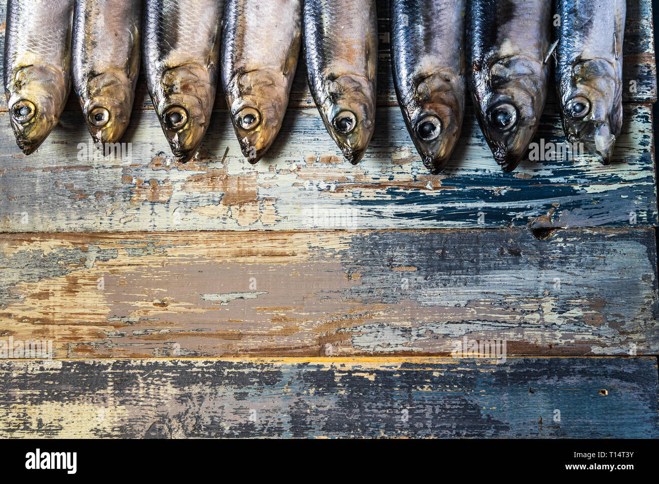 Rustic style. Fish pattern. Herring fish on an old blue wooden ...
