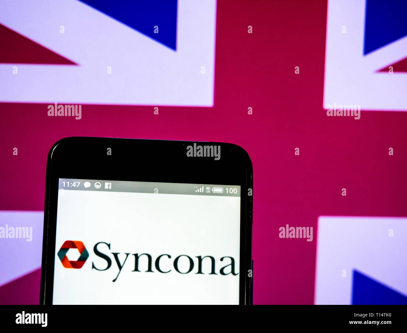 In this photo illustration a Syncona plc logo seen displayed on a smart ...