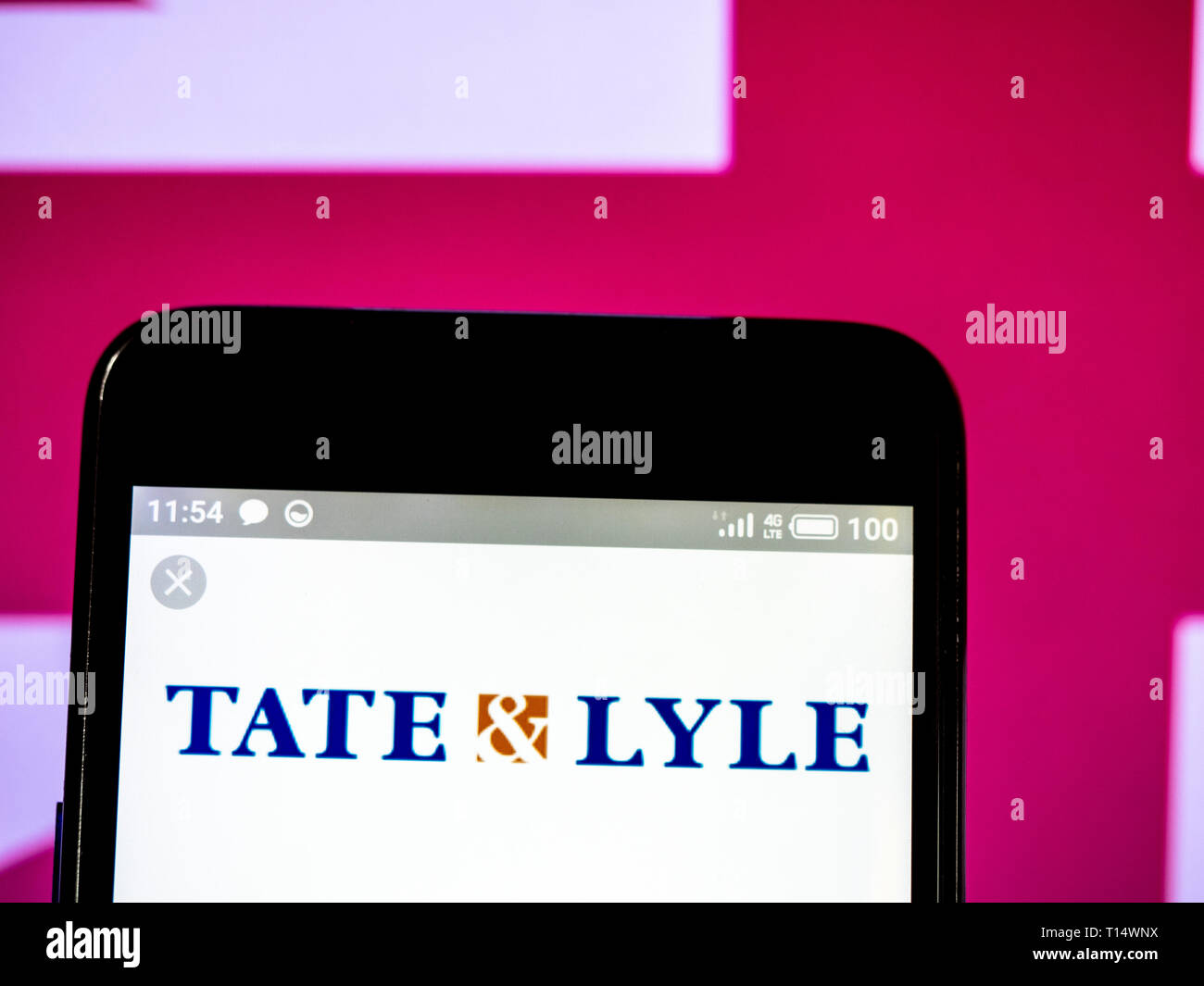 In this photo illustration a ate & Lyle PLC logo seen displayed on a ...