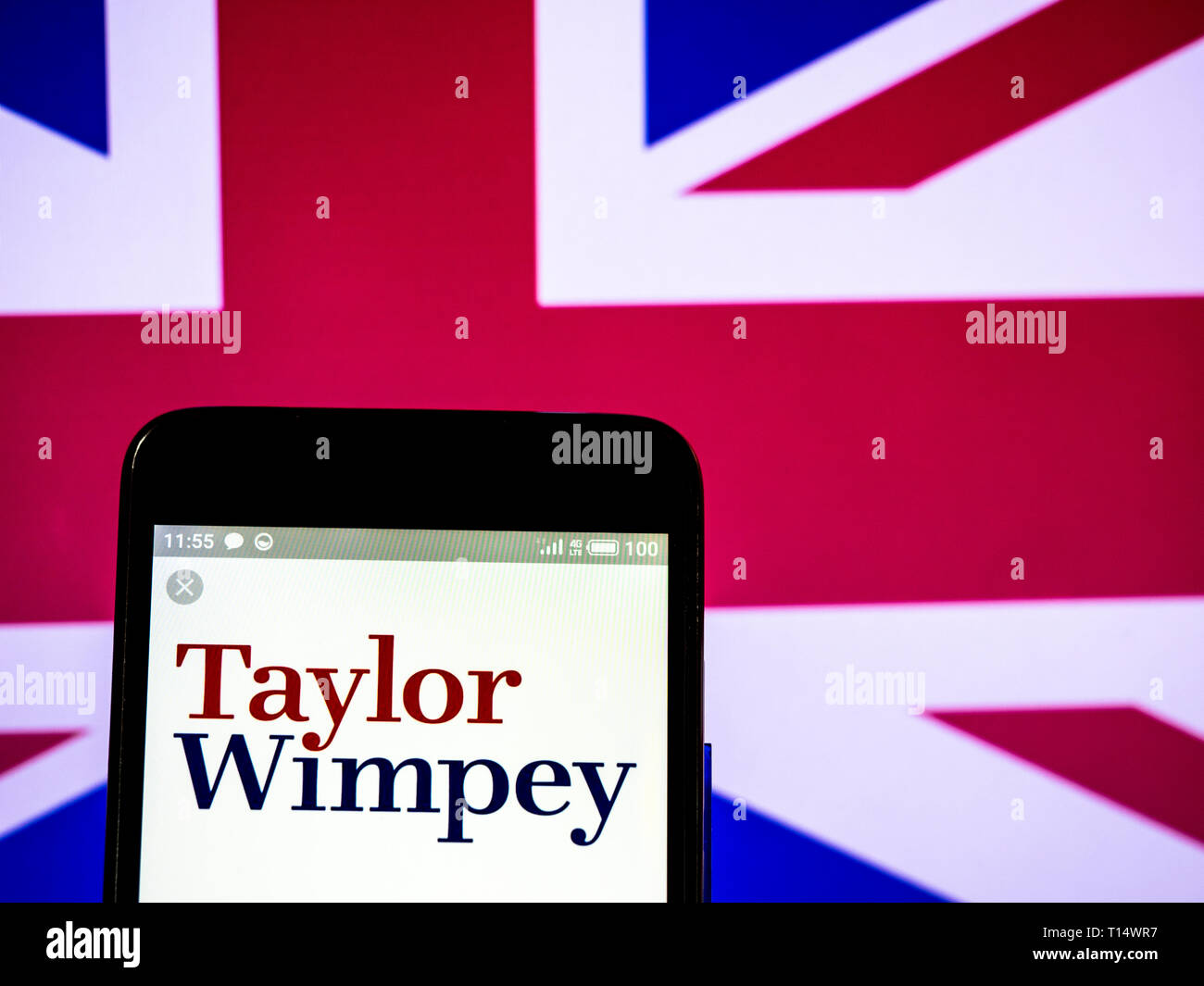 In this photo illustration a Taylor Wimpey plc logo seen displayed on a ...