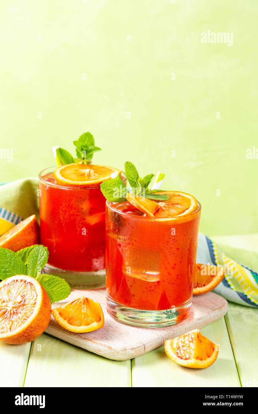 Bloody orange drink and ingredients, copy space Stock Photo - Alamy