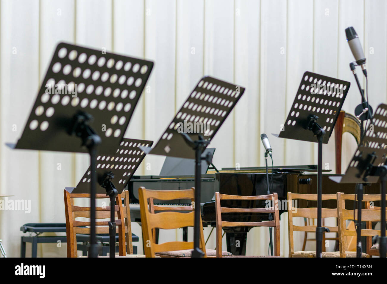 Empty seats and some instruments in music hall awaiting orchestra to ...