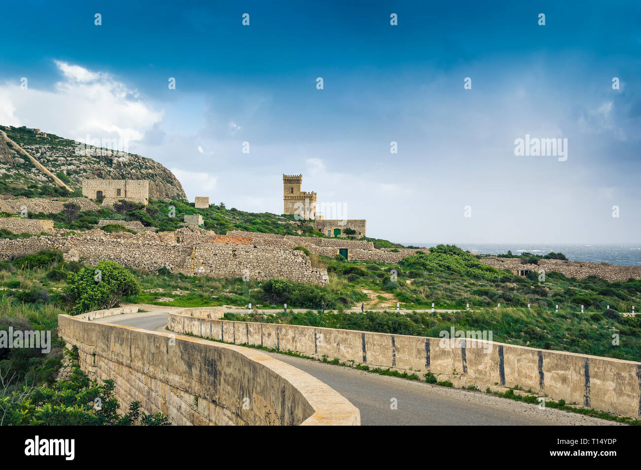 Malta: Scenic road to Ghar Lapsi tower with hilly landscape and sea ...