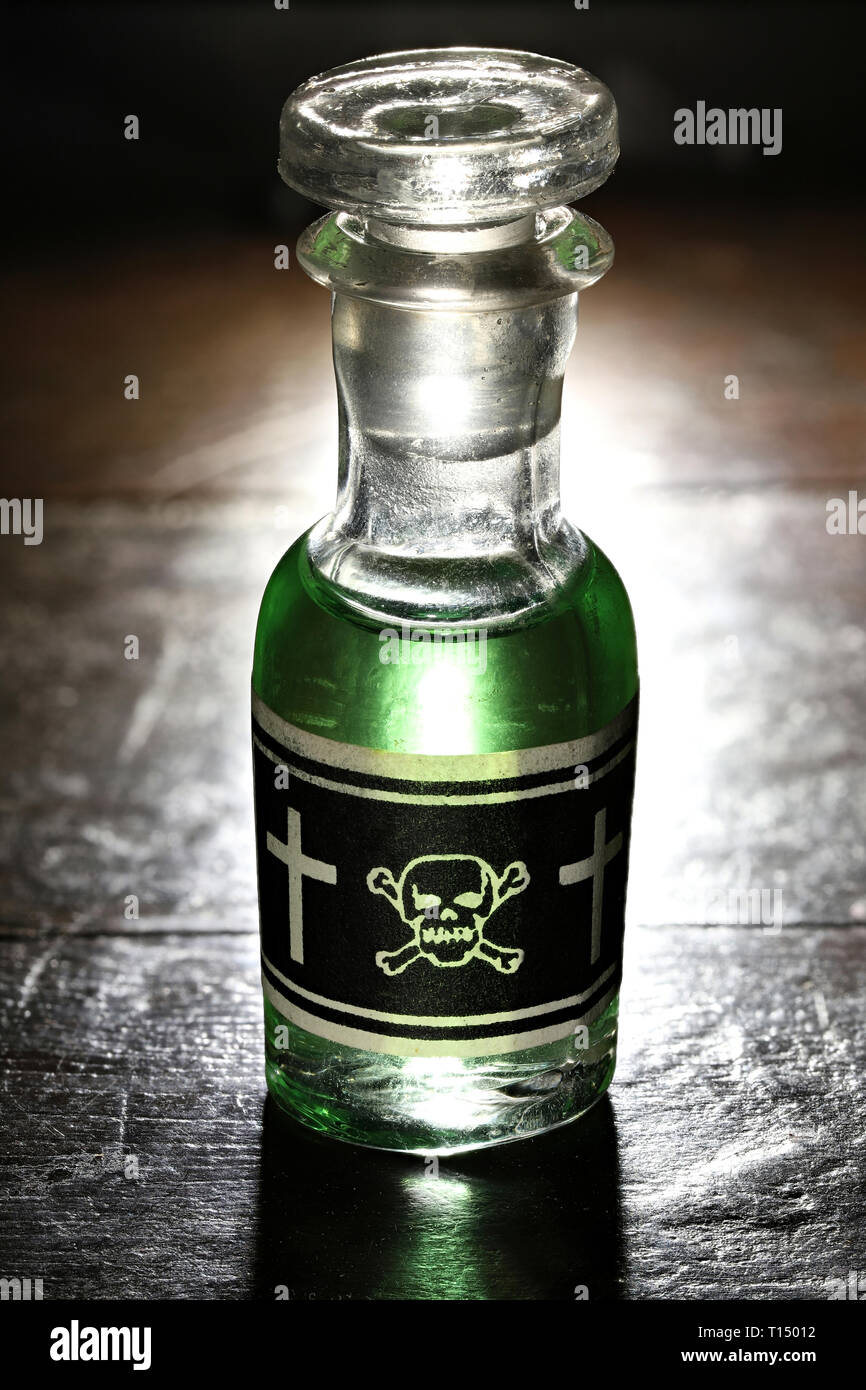 vintage glass bottle of poison Stock Photo - Alamy