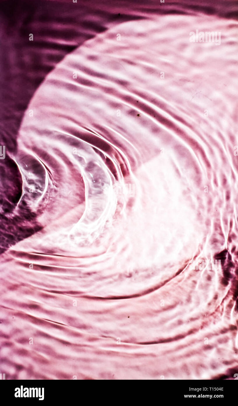 Pink flowing water texture as an abstract background - colourful ...