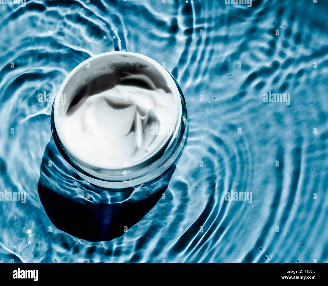 Sensitive skincare moisturizer cream on water background - clean beauty ...