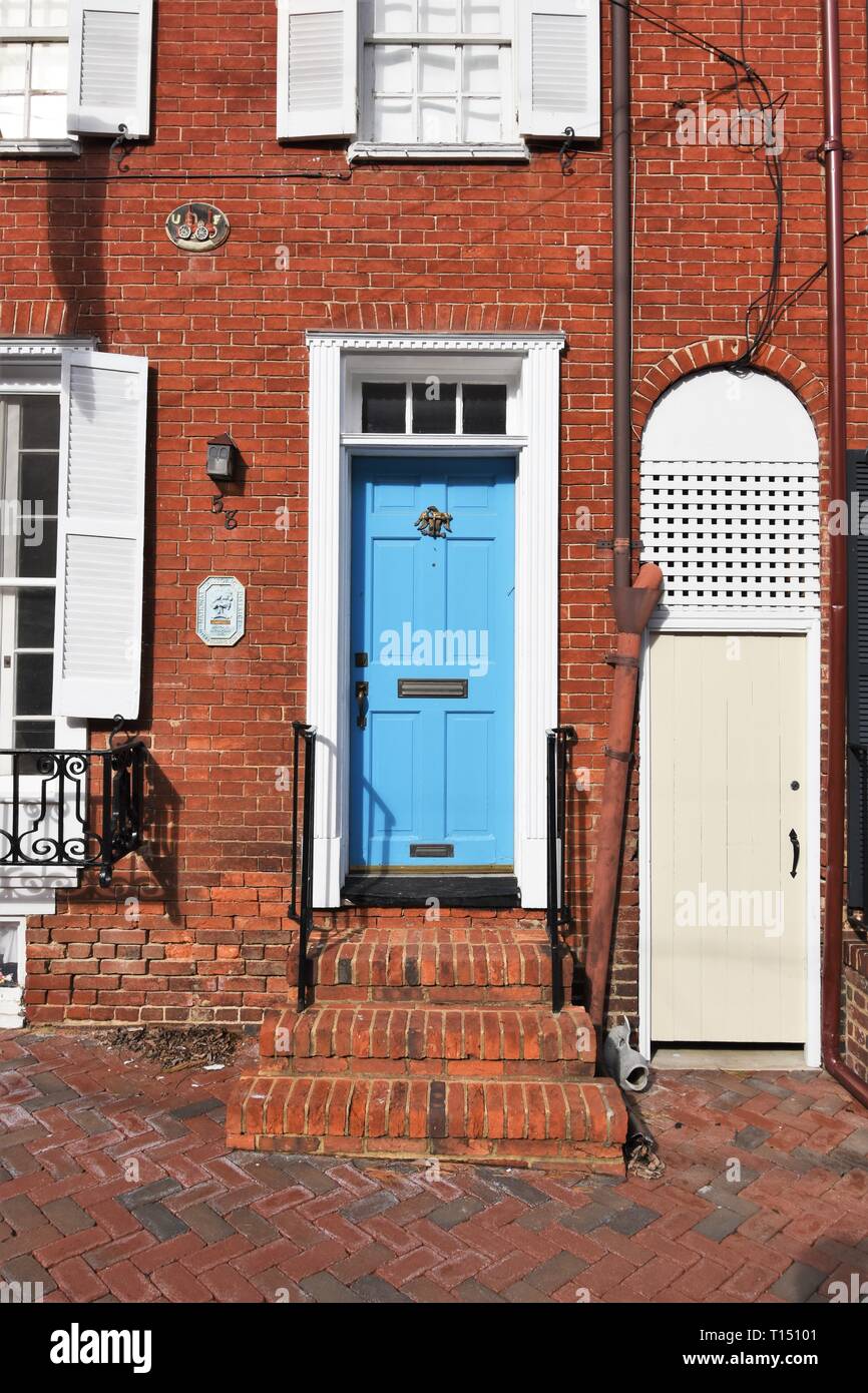 colorful new Blue door on a brick updated and renovated row house in ...