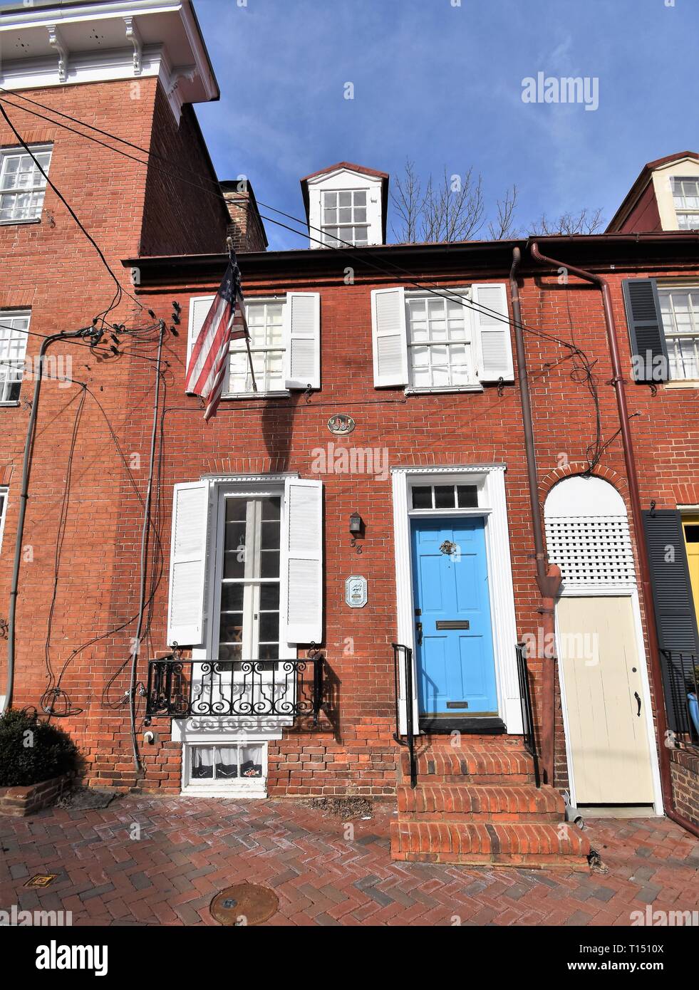 colorful new Blue door on a brick updated and renovated row house in ...