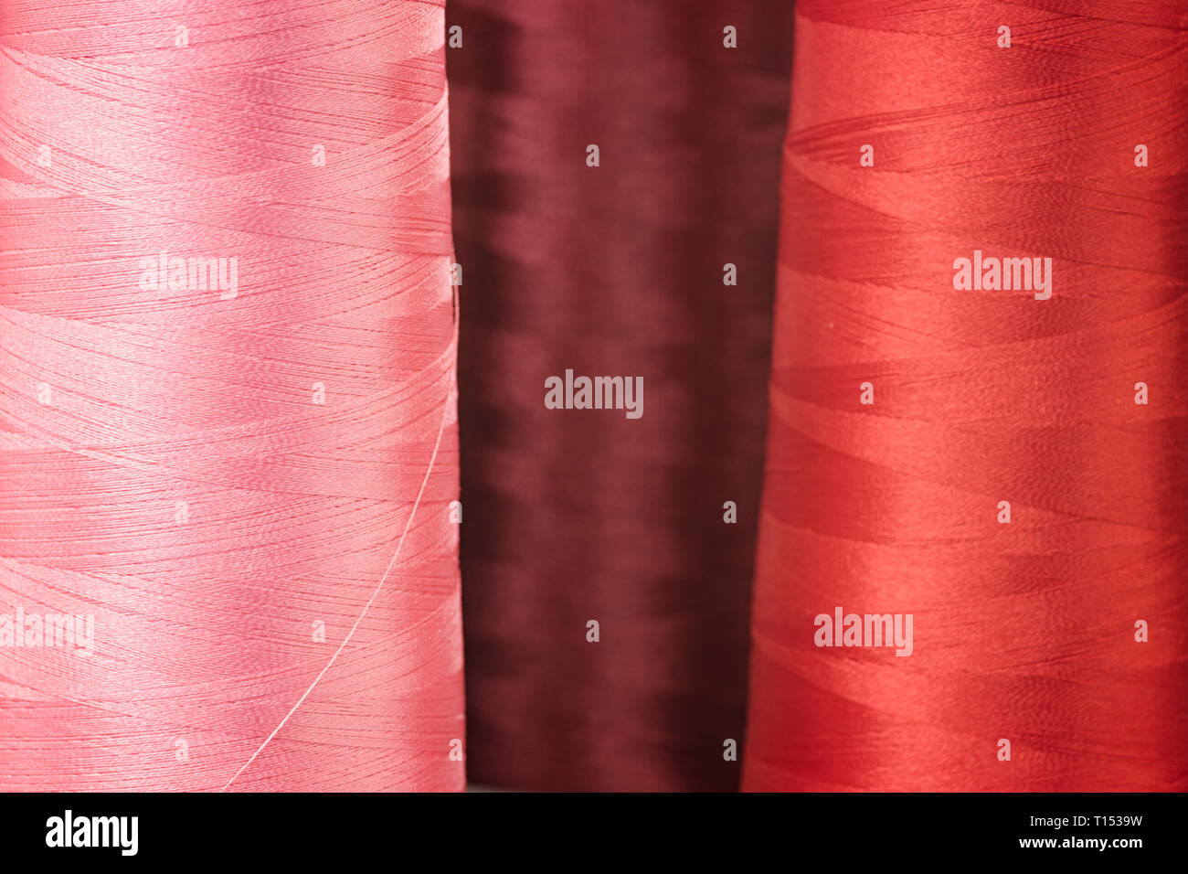 Colorful reels of threads. Background Stock Photo - Alamy