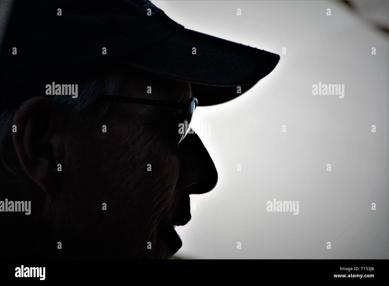 Silhouette of Man with Glasses Stock Photo - Alamy