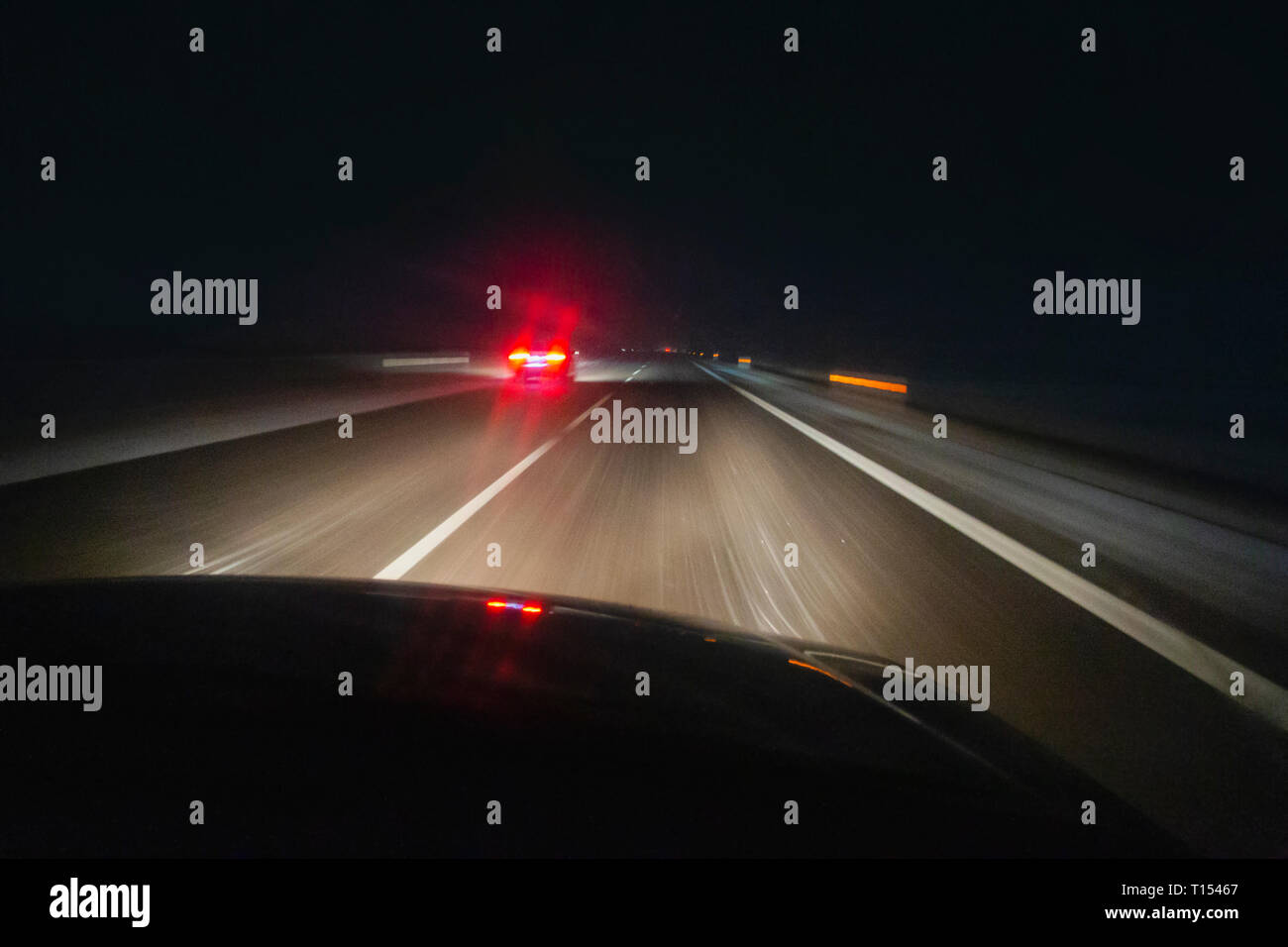 Black car driving at night hi-res stock photography and images - Alamy