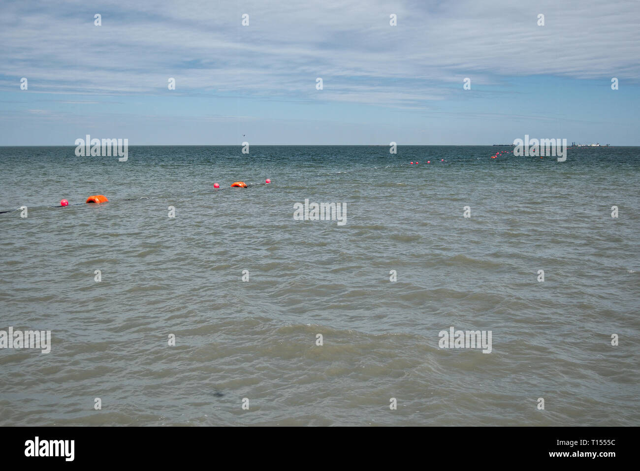 Buoys on a line floating in the ocean Stock Photo - Alamy