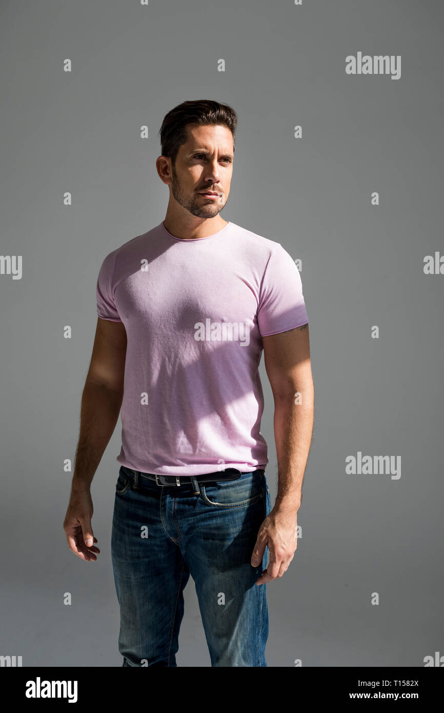Man standing in a loft in sunshine Stock Photo - Alamy