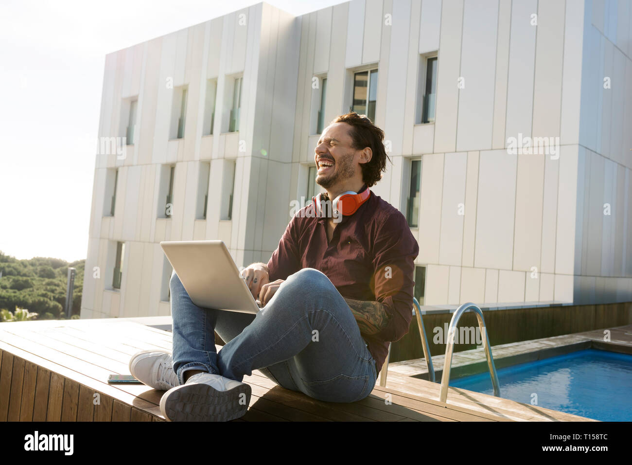 Man sitting rooftop terrace hi-res stock photography and images - Alamy