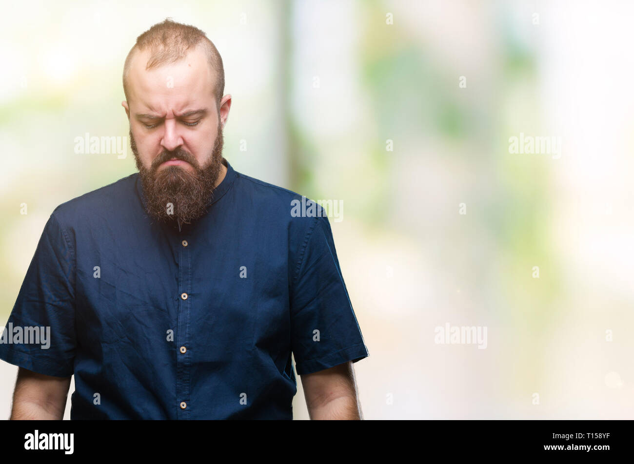 Young caucasian hipster man over isolated background depressed and ...