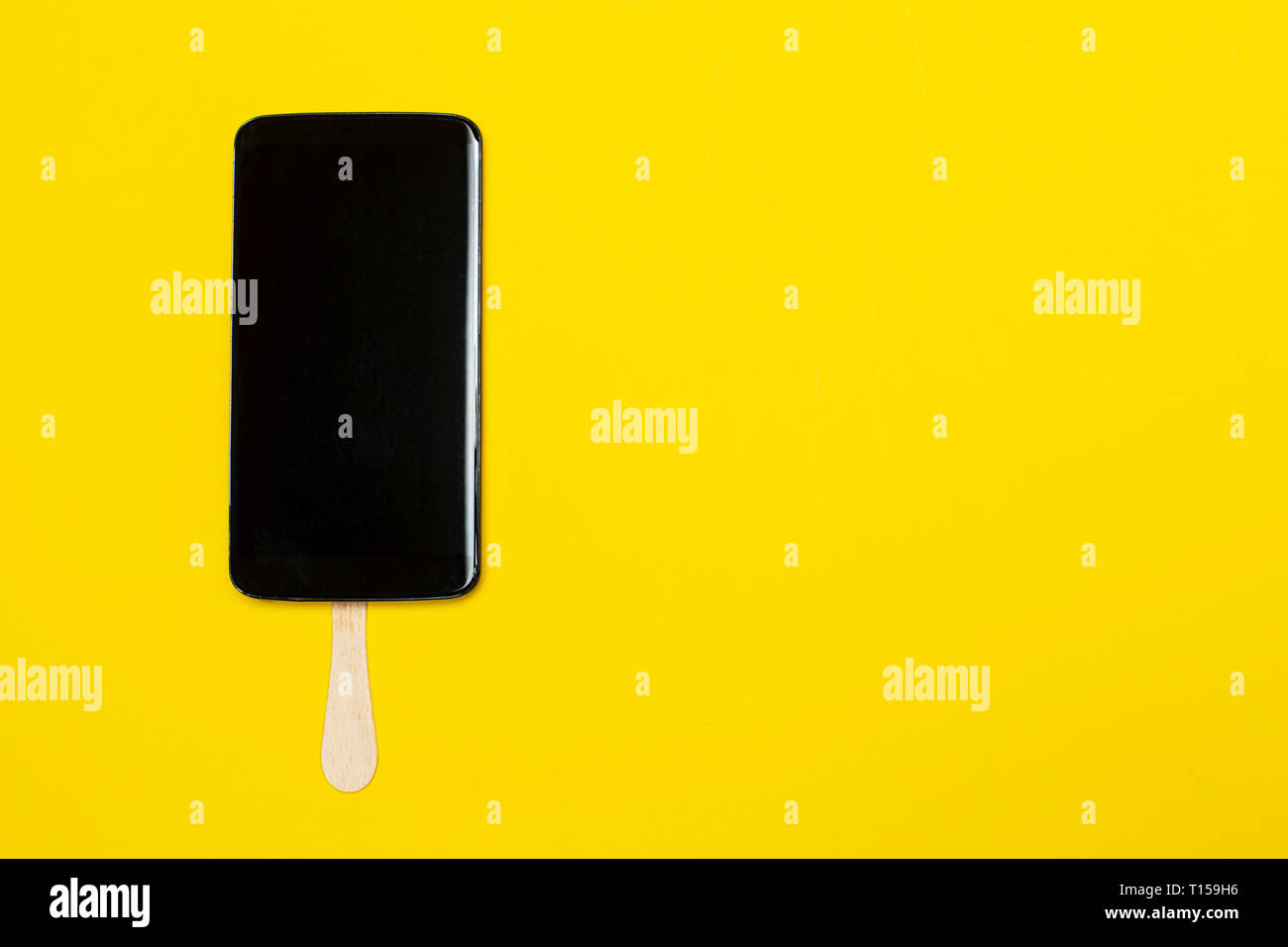 Mobile phone on a stick looks like a delicious chocolate popsicle ...