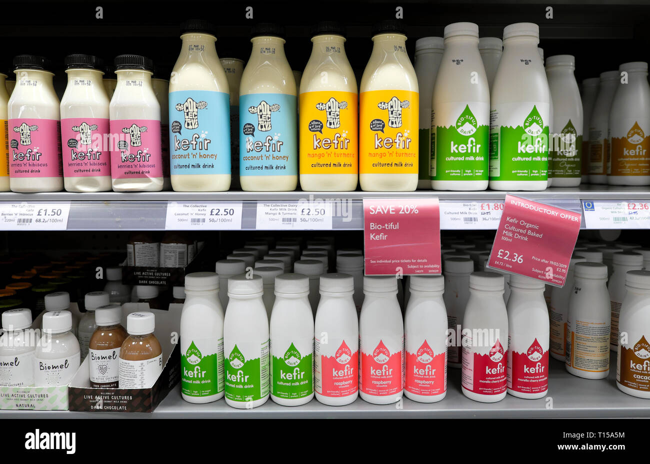 Bottles of various brands and flavour of kefir for sale on a ...
