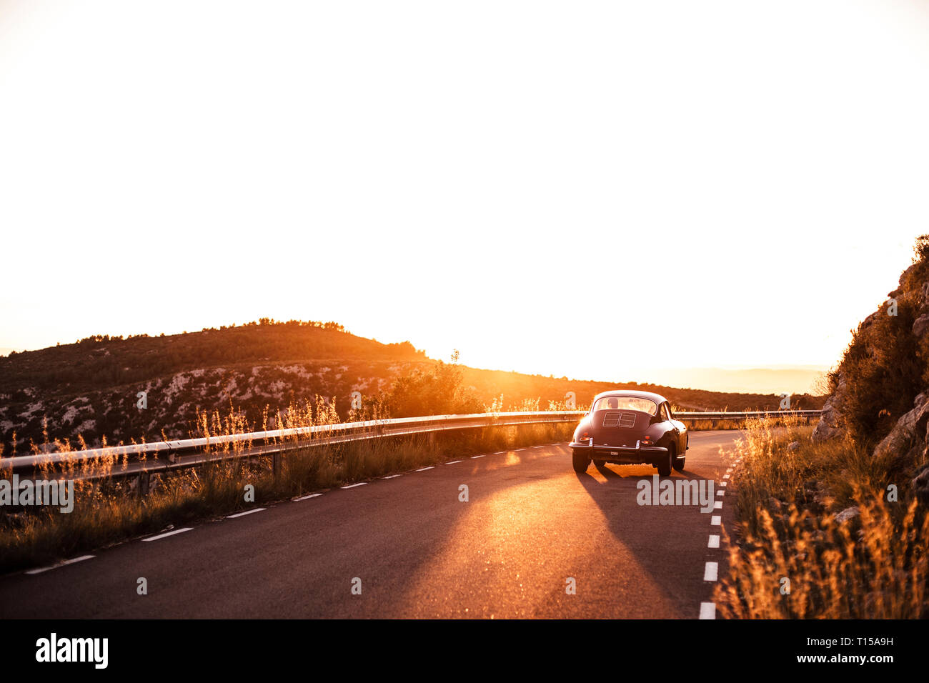 Spain, classic car driving on road during sunset Stock Photo - Alamy Spain, classic car driving on road during sunset Stock Photo - Alamy