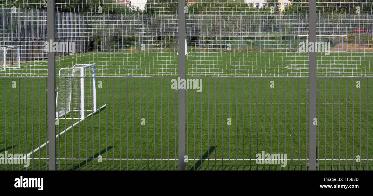 football field near fence at day sunny day Stock Photo - Alamy