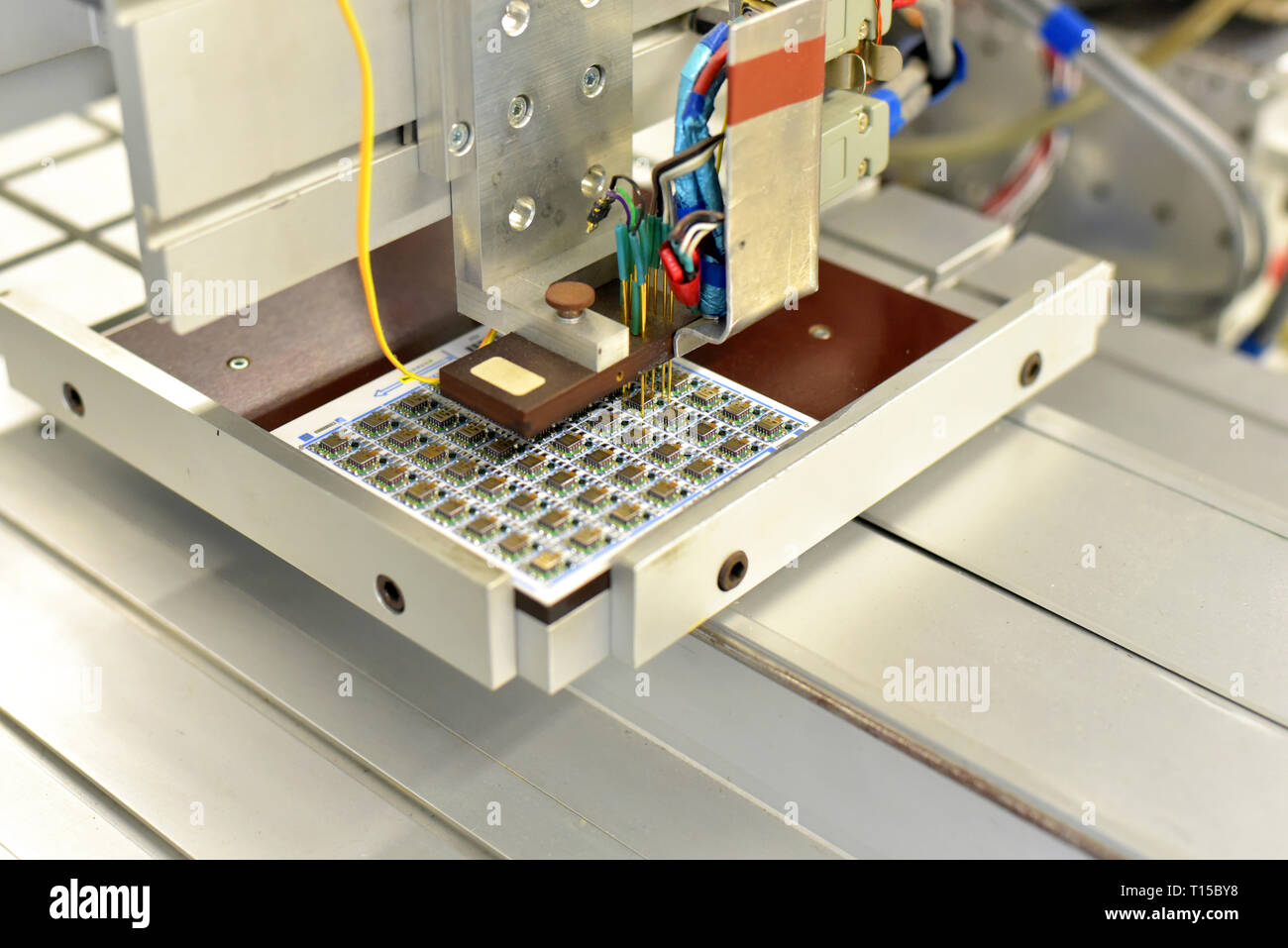 Close-up of loading of circuit boards in a factory Stock Photo - Alamy