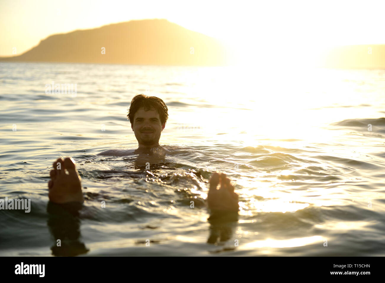 Man relaxing by water hi-res stock photography and images - Alamy