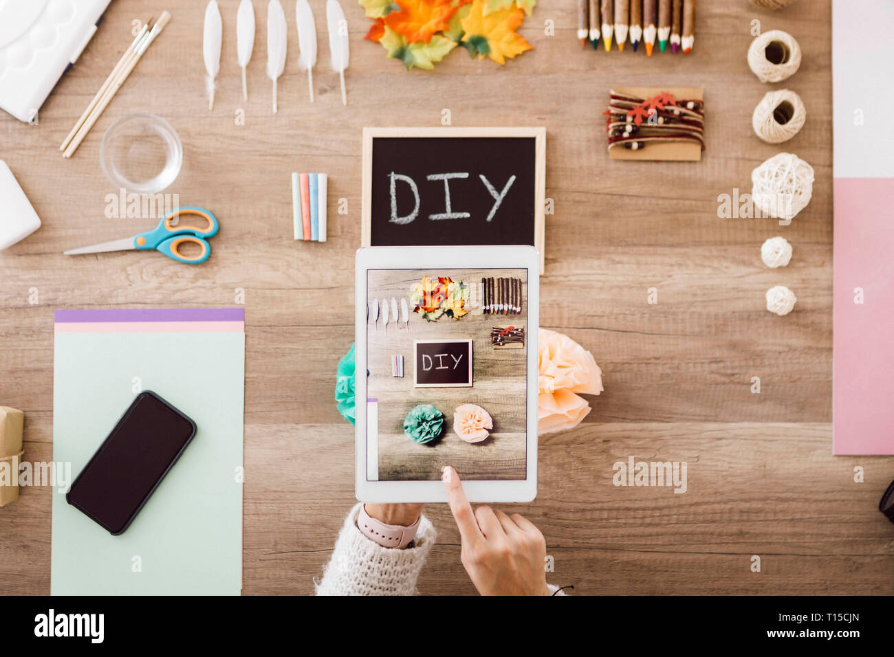 Top view of young woman making photos with the tablet for her blog of ...
