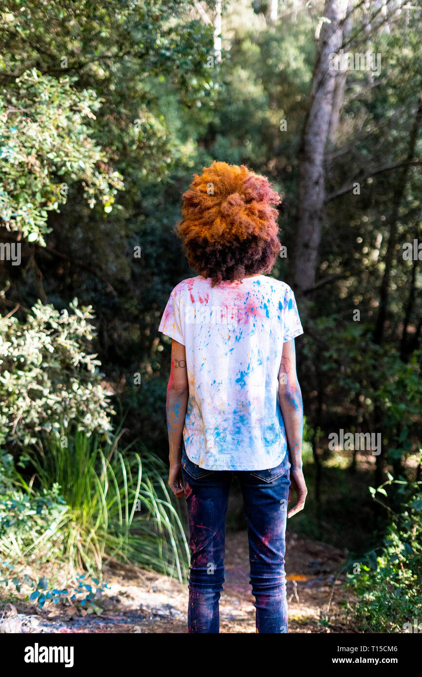 Woman covered in powder paint, celebtaing Holi, Festival of Colors ...