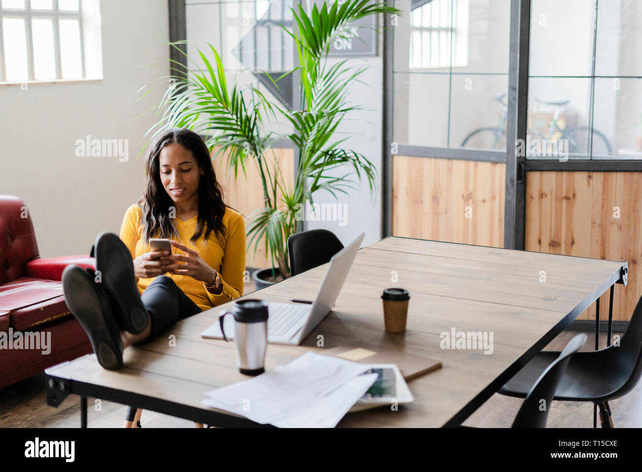 Feet desk phone hi-res stock photography and images - Alamy