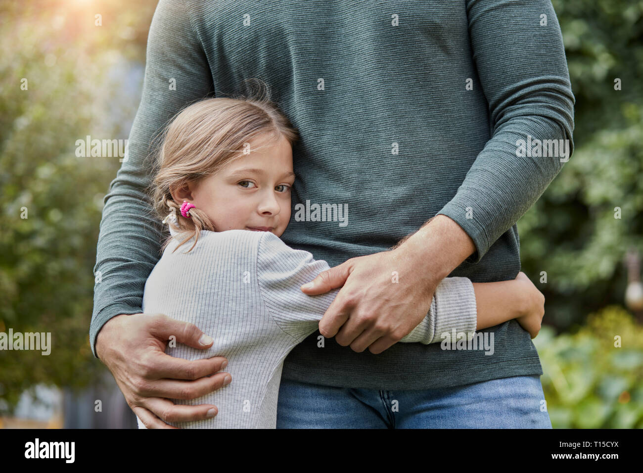 Girl hugging father in hi-res stock photography and images - Alamy