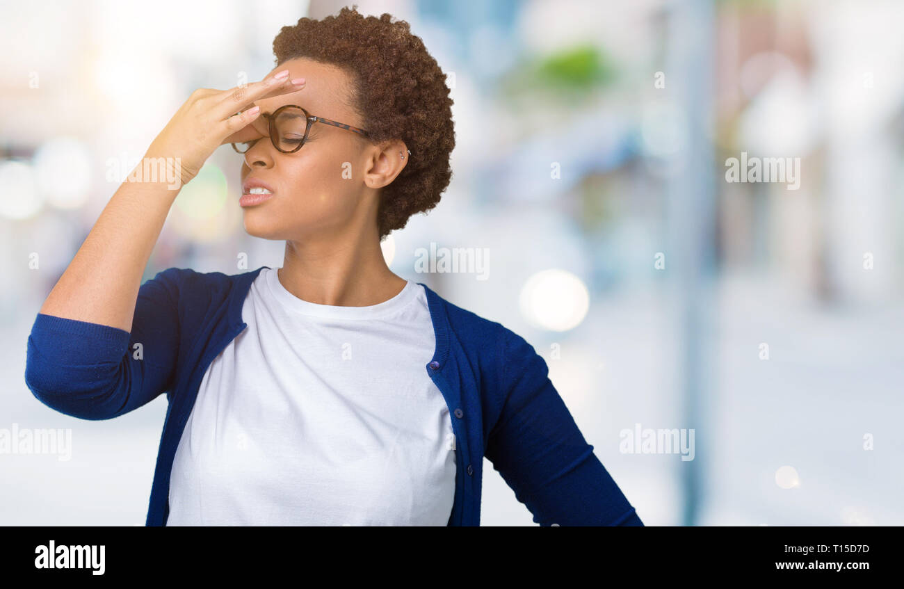 Young beautiful african american woman wearing glasses over isolated ...