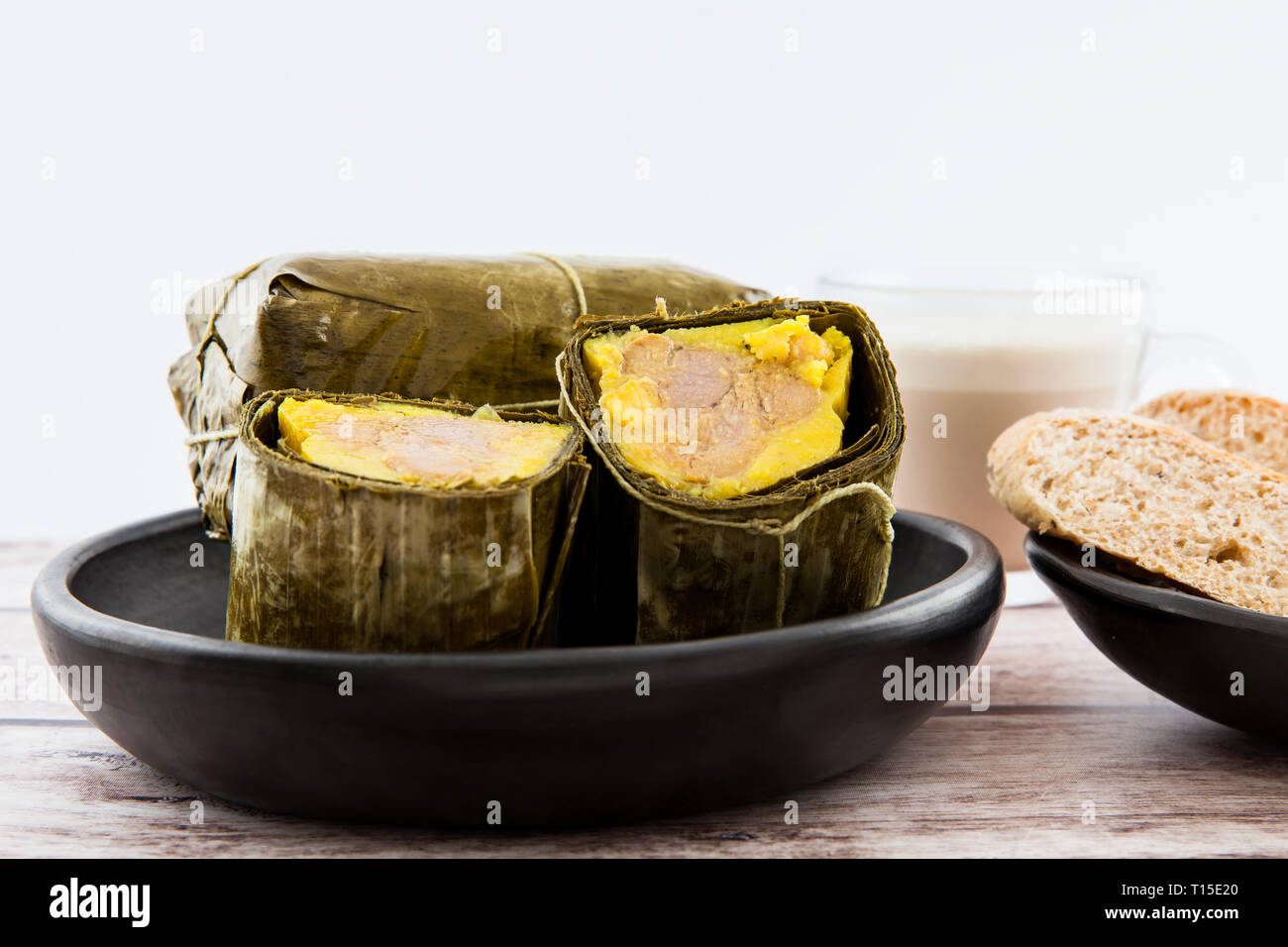 Traditional Colombian tamale breakfast with bread and chocolate as made ...