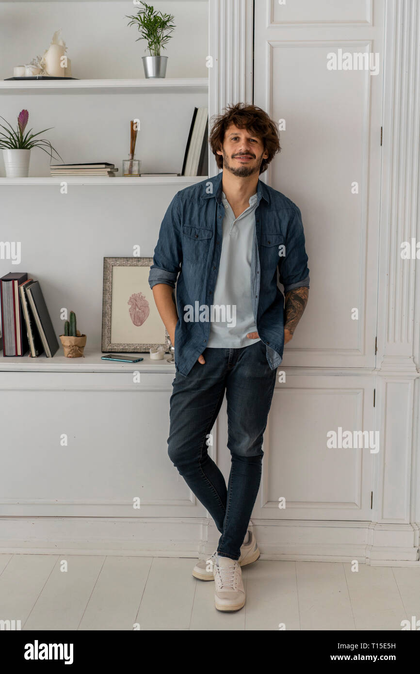 Man working standing coworking space, looking confident Stock Photo - Alamy