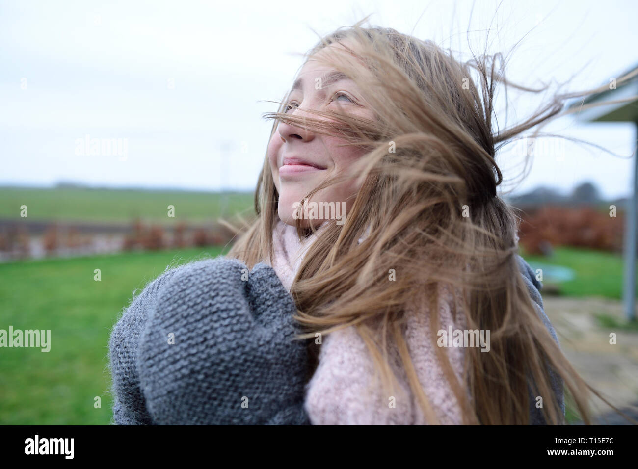 Portrait smiling girl blowing hi-res stock photography and images - Alamy