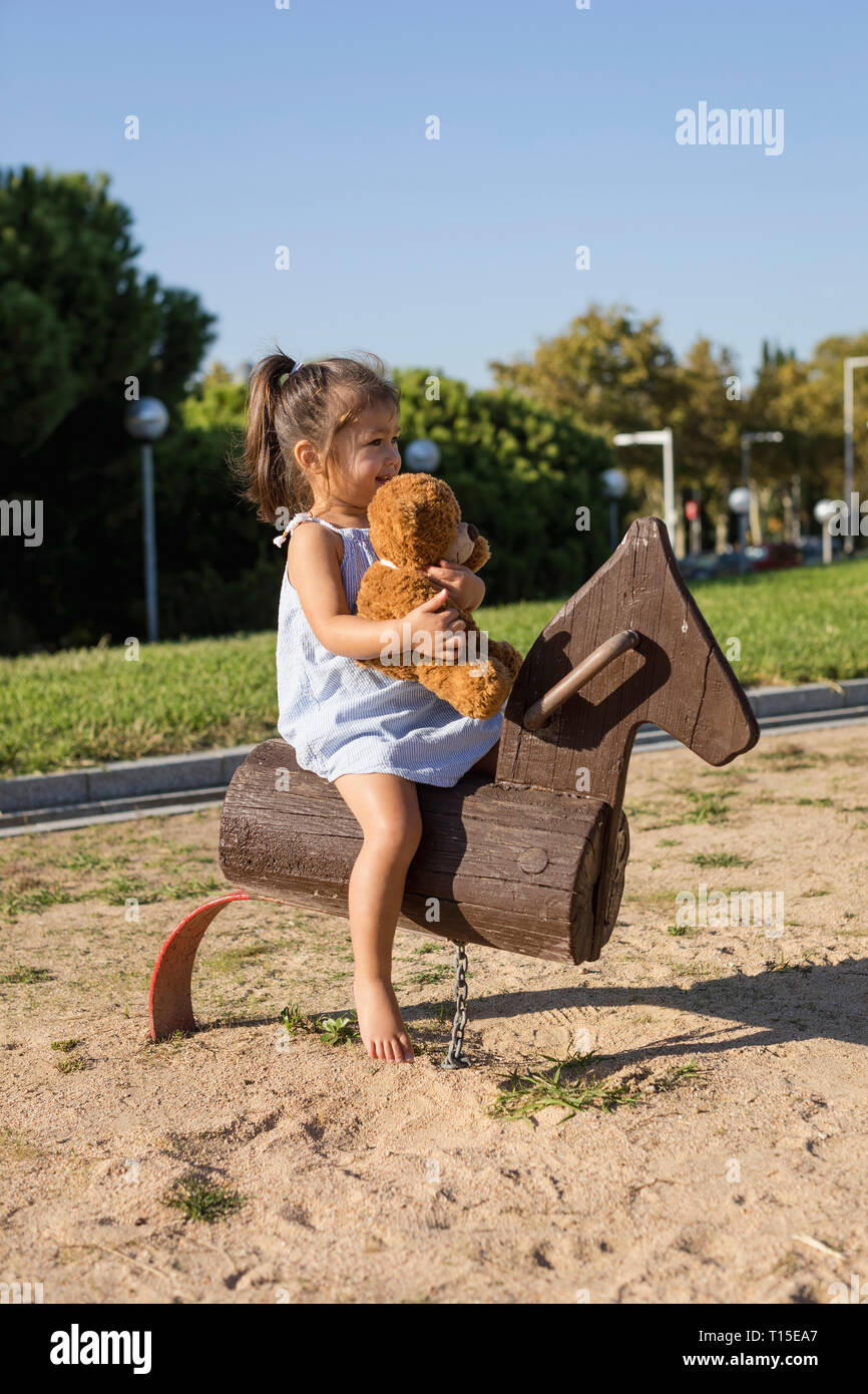 Playground rocking horse Stock Photo - Alamy