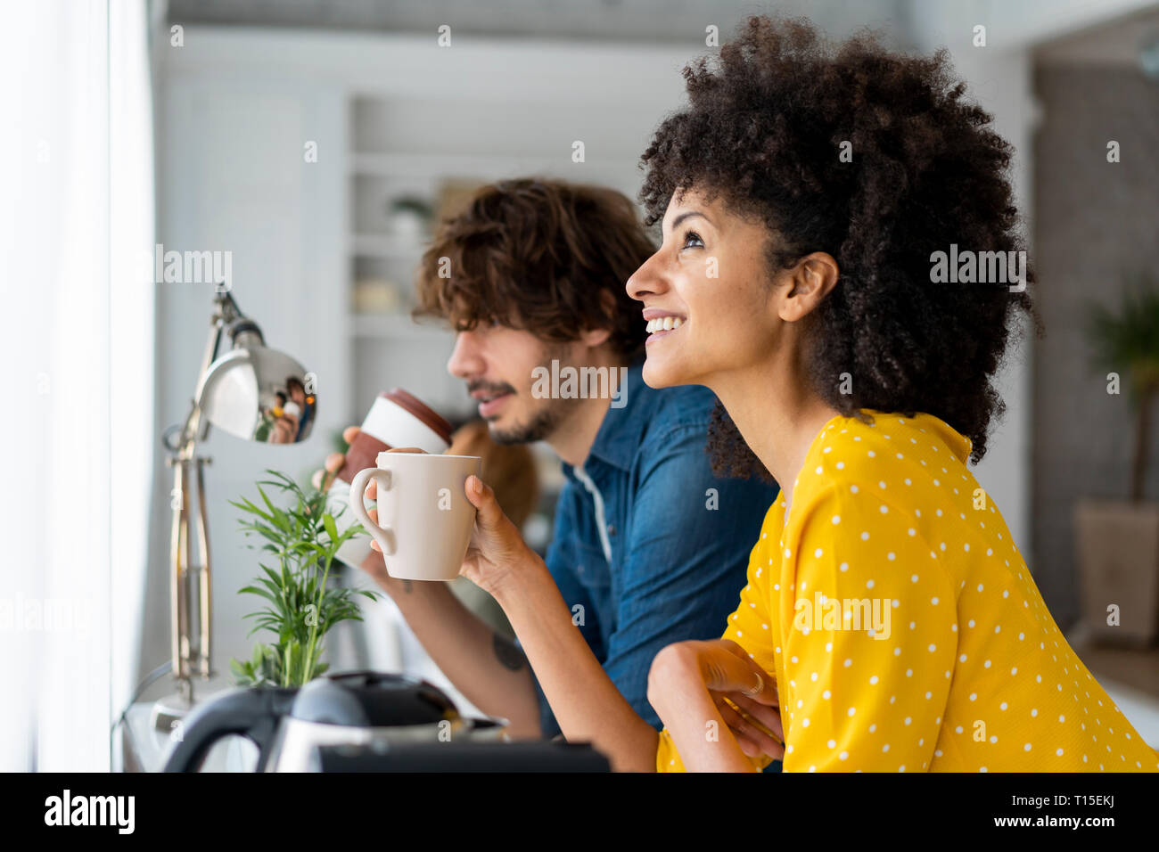 Colleagues having a coffee break in the office Stock Photo - Alamy