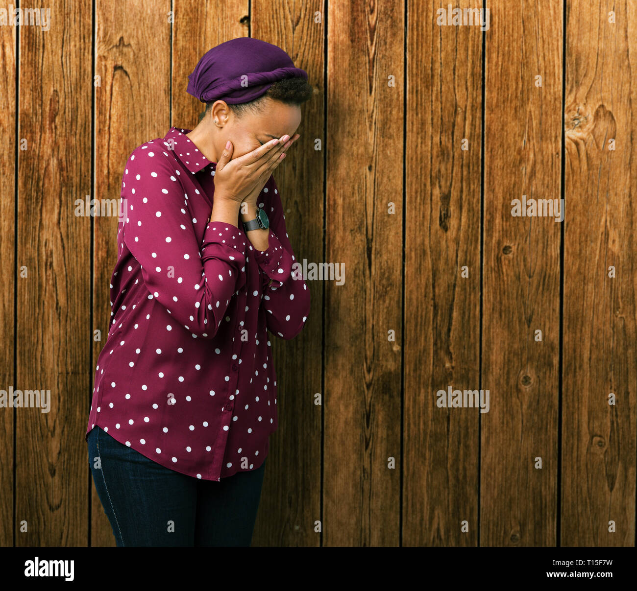 Beautiful young african american woman wearing head scarf over isolated ...