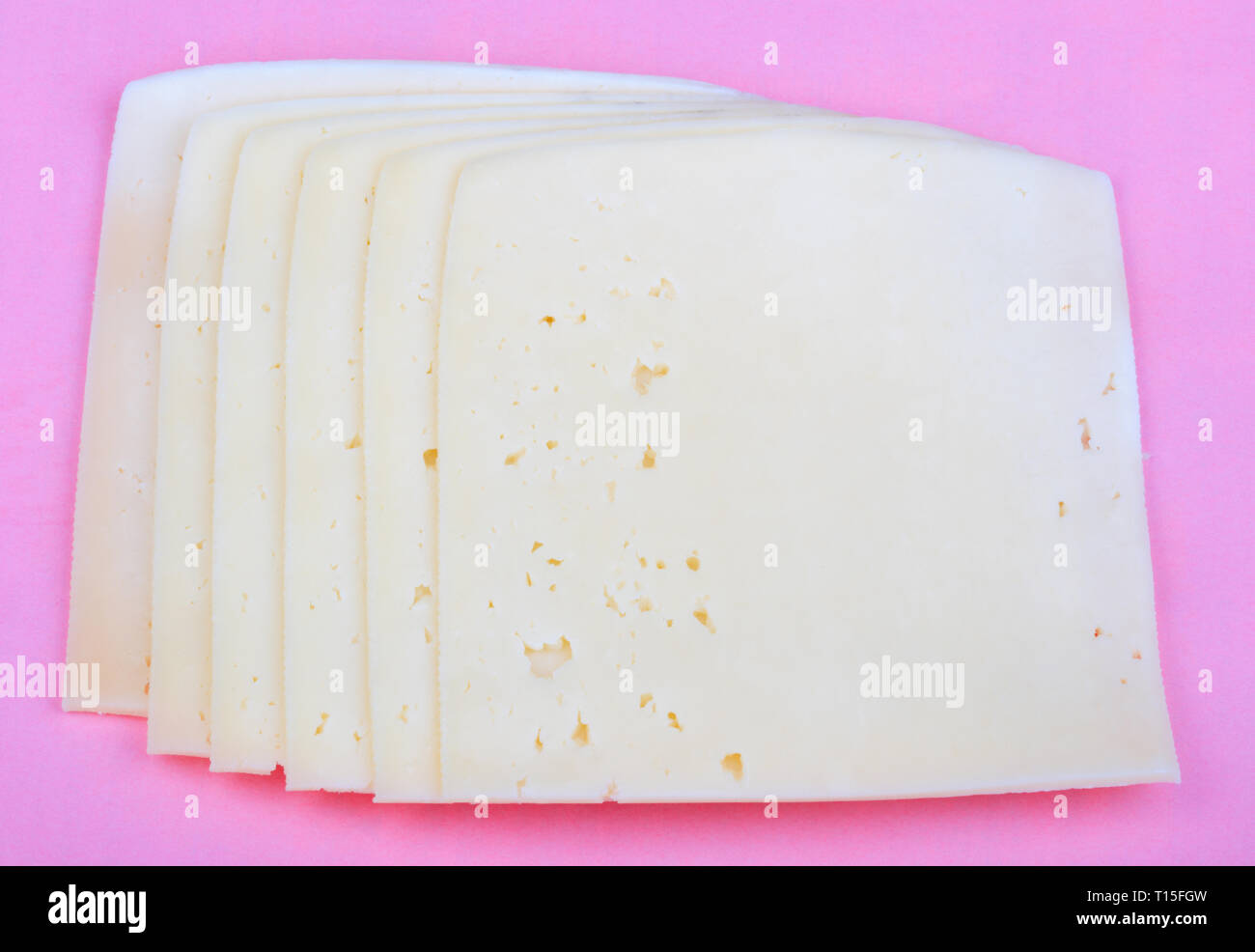 Cheese on Pink Background Stock Photo - Alamy